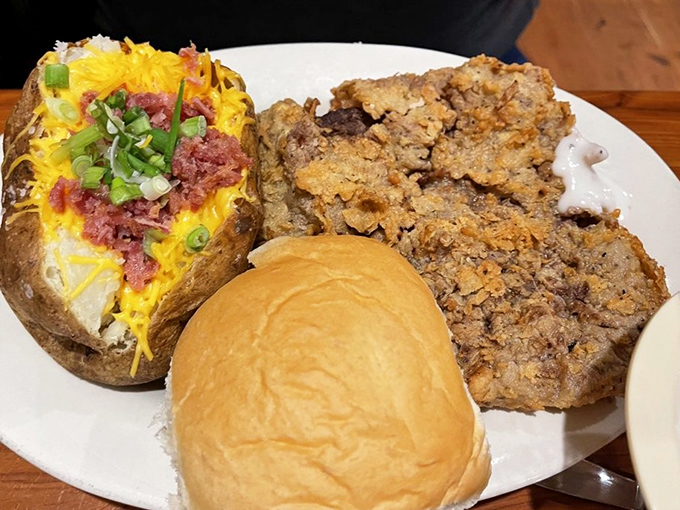 That's not just chicken fried steak&mdash;it's a masterpiece of crispy, peppery perfection alongside a loaded baked potato that's practically begging to be devoured.