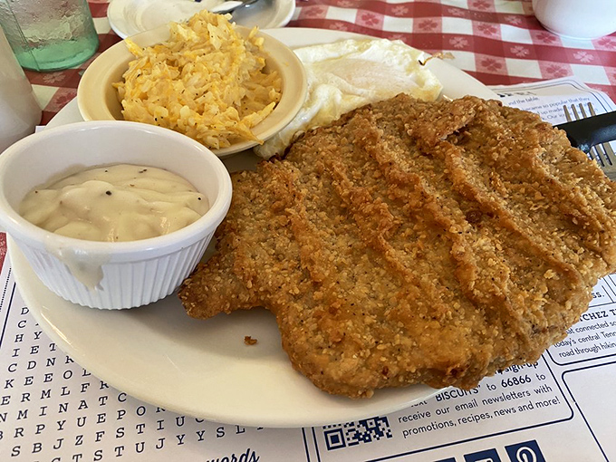 Golden-crusted country fried steak that shatters with each fork press, sided with creamy white gravy. This isn't just dinner; it's edible therapy.