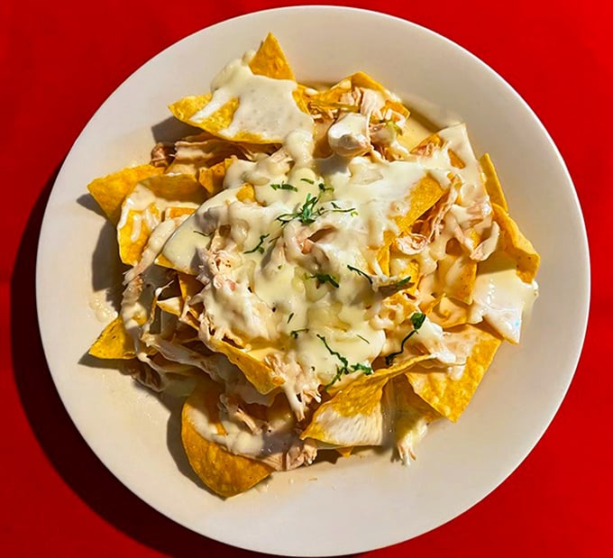 These nachos aren't just a snack&mdash;they're an architectural marvel of crispy chips, melty cheese, and chicken that had a higher calling than fast food.