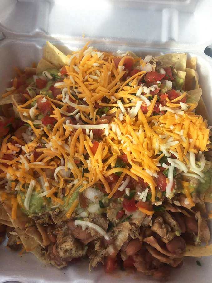 Nacho architecture at its finest! Layers of chicken, cheese, and fresh toppings create a masterpiece that would make Frank Gehry jealous.