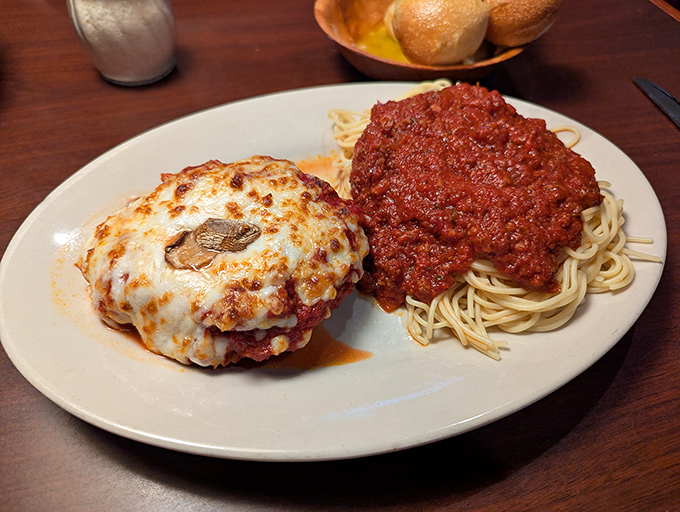 This chicken parmesan has achieved the holy trinity: crispy exterior, tender interior, and enough cheese to make Wisconsin nervous. 