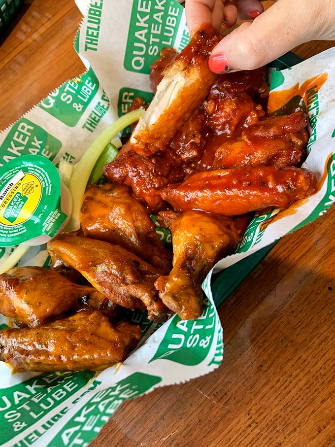 These aren't just wings—they're a saucy masterpiece. Glistening with flavor and served with the obligatory celery sticks, they're worth getting your fingers sticky for.