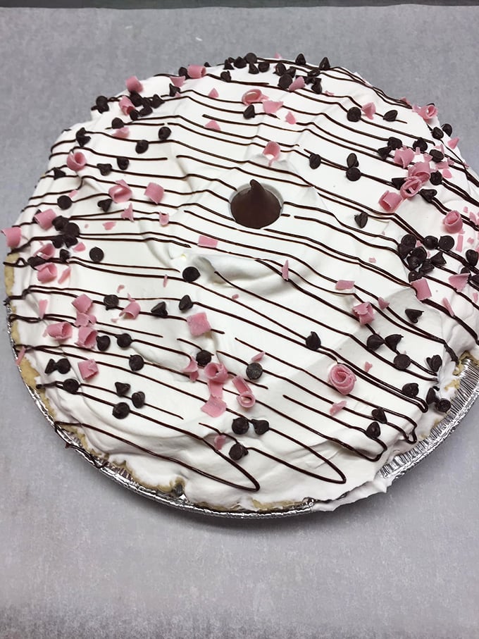 This chocolate cream pie isn't just dessert&mdash;it's therapy. The artful chocolate drizzle suggests someone in the kitchen actually cares about your happiness.