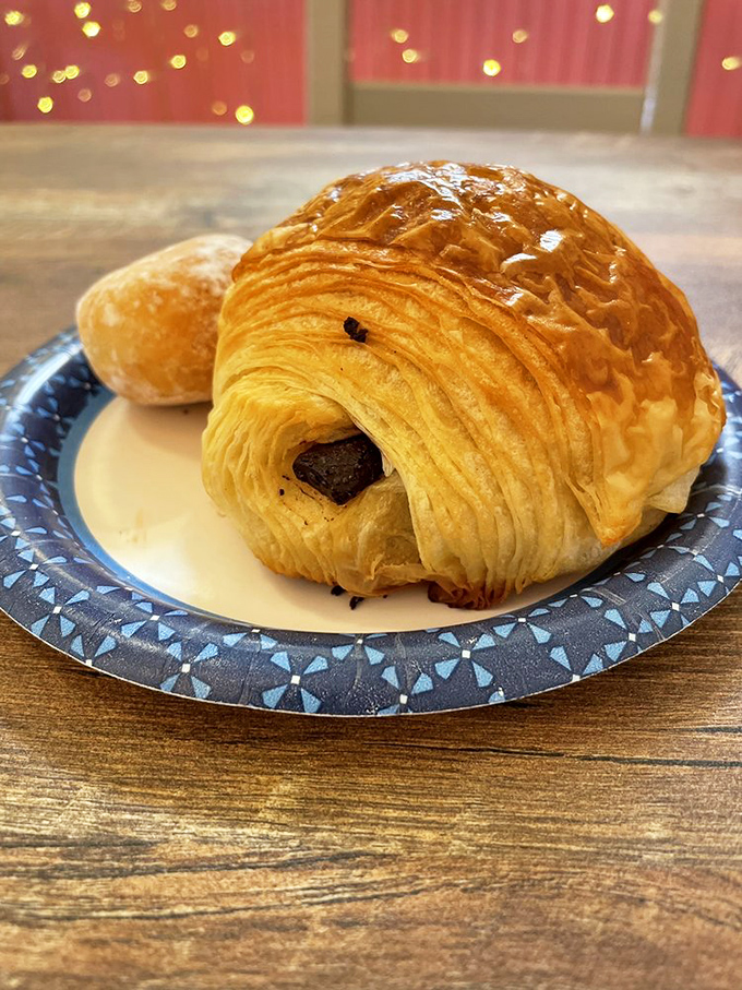 Layers upon buttery layers, with chocolate peeking out like it's playing hide and seek. This pain au chocolat doesn't need a passport to transport you.