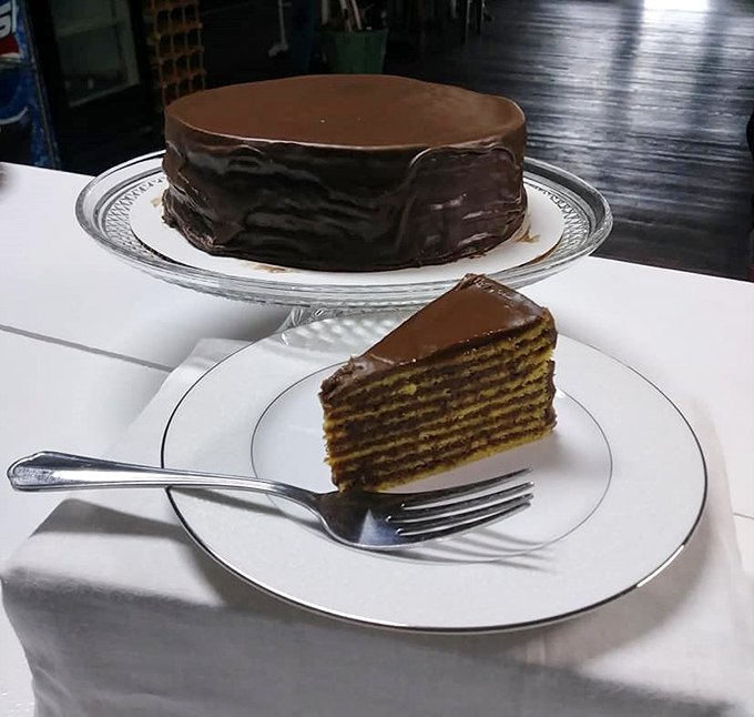 Layer upon thin layer of yellow cake embraced by chocolate frosting &ndash; the classic Smith Island Cake reveals its architectural splendor when sliced.