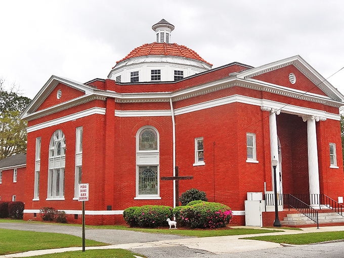 This stunning red brick church isn't just a building&mdash;it's the architectural equivalent of Sunday best, complete with gleaming white columns and a dome that commands attention.