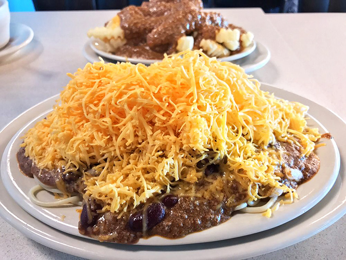Behold the legendary five-way: a mountain of finely shredded cheddar atop Cincinnati's signature spiced chili. It's not a meal&mdash;it's an architectural achievement.