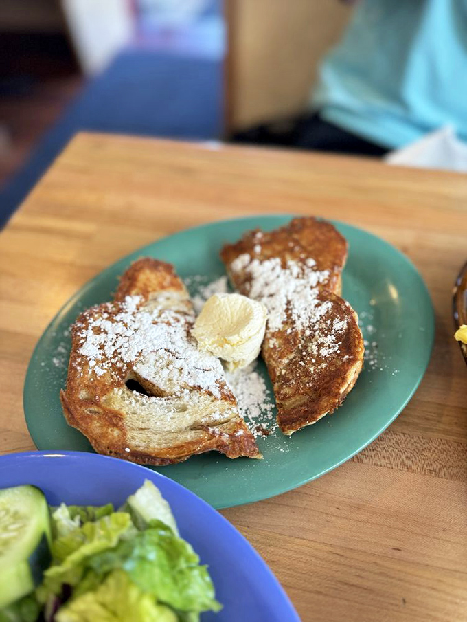 Golden-crisp cinnamon French toast dusted with powdered sugar&mdash;proof that sometimes the simplest pleasures are worth traveling 8,000 feet above sea level for.