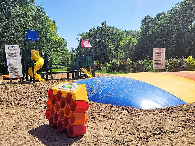 Who needs expensive theme parks when Baraboo offers this colorful playground paradise? That bouncy pillow probably has better suspension than my first car.