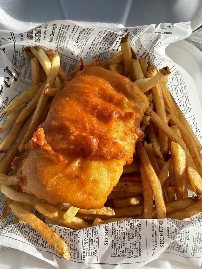 Golden, crispy perfection nestled on a bed of hand-cut chips. This isn't fast food; it's a slow love letter to British culinary tradition.