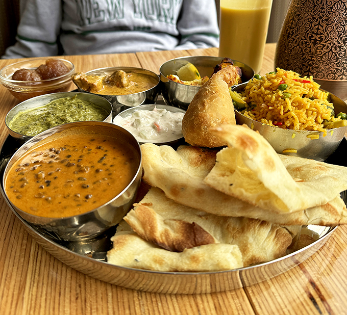 The thali experience&mdash;where every metal bowl contains its own universe of flavor. Like a flavor solar system on your table.
