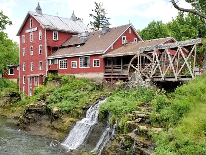 Clifton Mill stands as a postcard-perfect reminder of America's industrial past, where water power meets architectural charm beside a cascading waterfall.