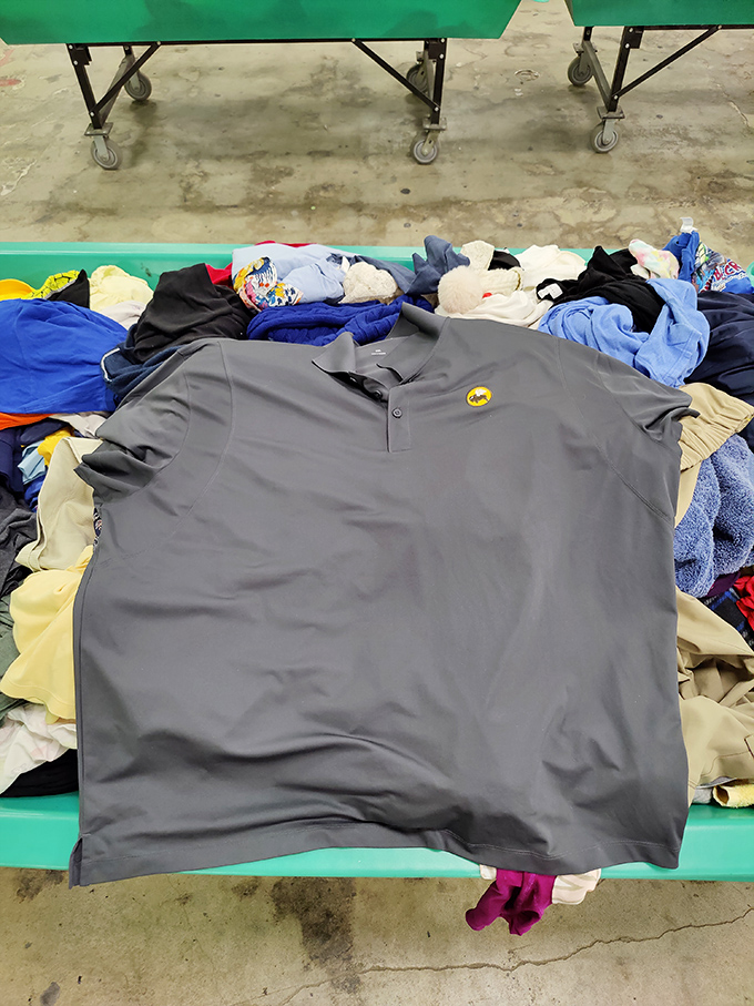 Mountains of clothing await, each piece a potential gem hiding among the textile treasures.
