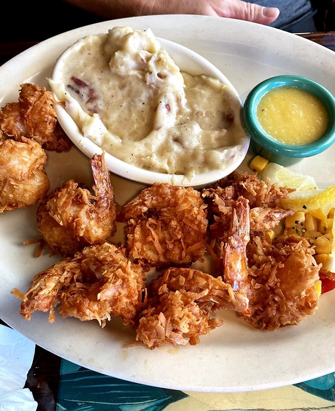 Golden coconut shrimp that crunch louder than your flip-flops on the boardwalk. That dipping sauce deserves its own fan club.