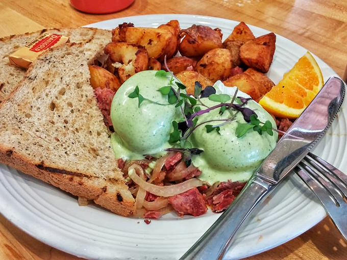 This isn't just corned beef hash; it's breakfast alchemy where crispy potatoes and savory meat support perfectly prepared eggs.