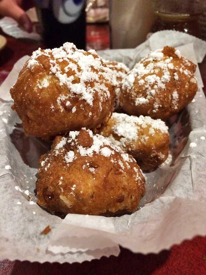 Golden-brown corn fritters dusted with powdered sugar&mdash;proof that sometimes the best things in life are deep-fried and slightly sweet.