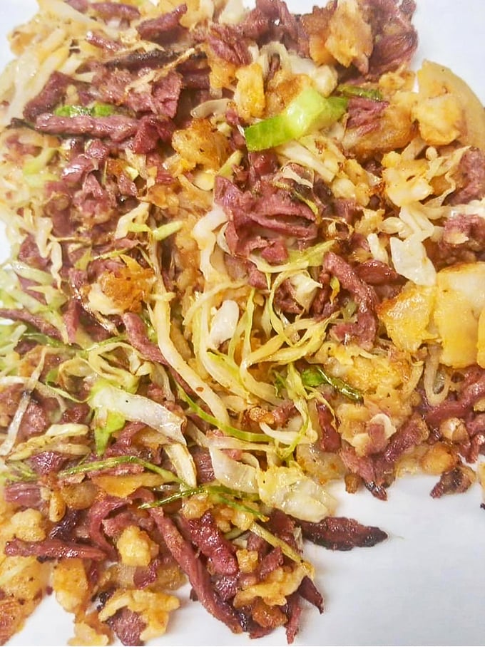 Behold the holy grail &ndash; Village Diner's famous corned beef hash, where crispy edges meet tender chunks in perfect breakfast harmony.