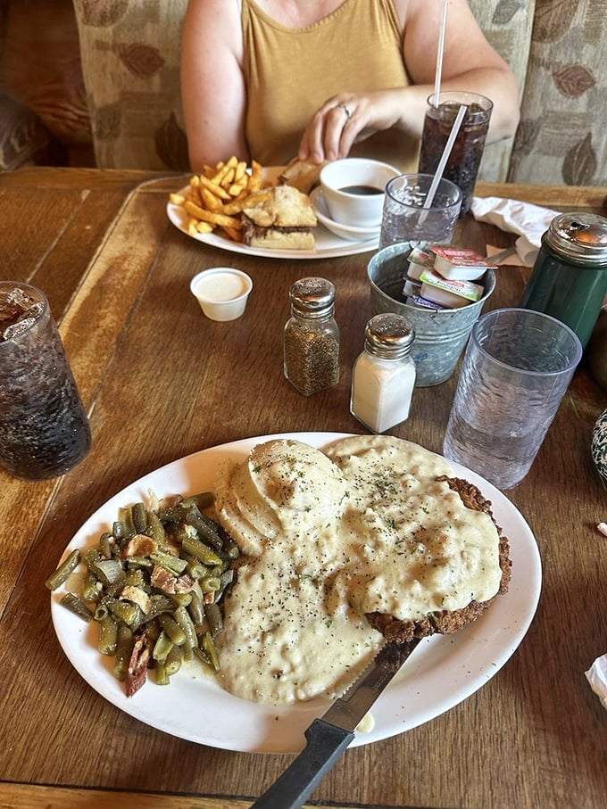 Country fried steak that deserves its own zip code &ndash; crispy exterior giving way to tender beef, all swimming in gravy that could make cardboard taste gourmet.