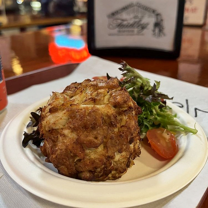 Behold the legendary Faidley's crab cake &ndash; a golden-brown masterpiece that's more crab than cake. This is what seafood dreams are made of.