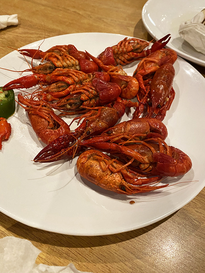 These crawfish look like they're having their own little pool party on your plate. Vibrant, spicy, and demanding to be the center of attention.