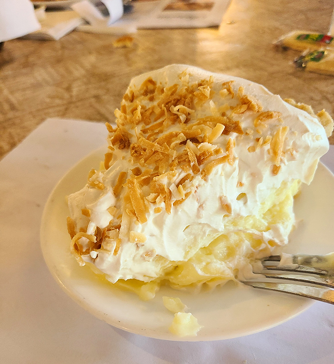 This coconut cream pie doesn't just satisfy a sweet tooth – it's a cloud-like testament to generations of Amish baking wisdom topped with toasted coconut perfection.