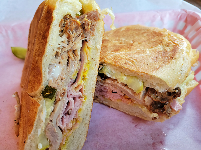 The Cuban sandwich in all its pressed, melty glory. Architecture of flavor where every layer plays its part perfectly.