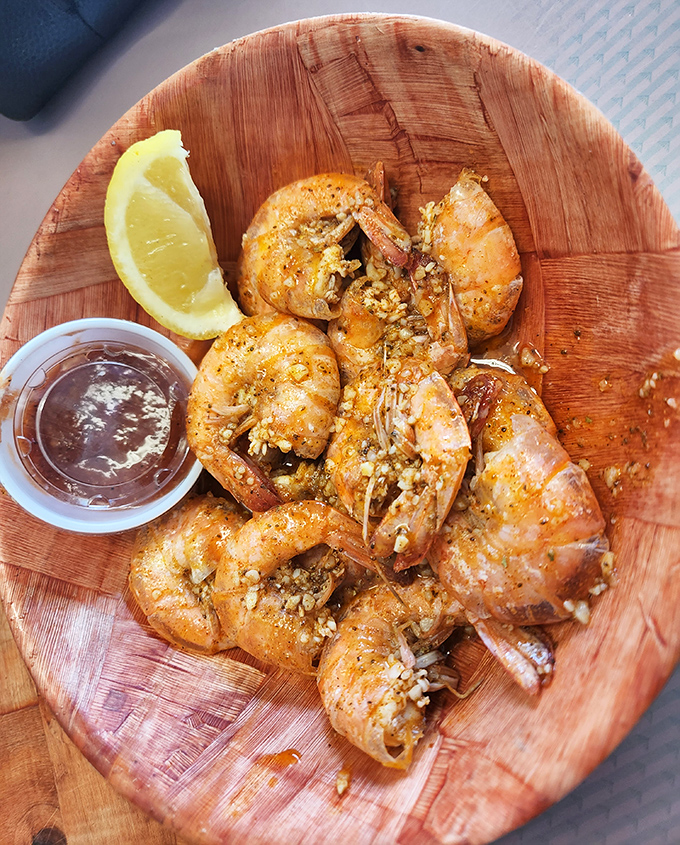 These plump, garlic-kissed shrimp aren't just seafood; they're a compelling argument for driving across multiple counties with only one destination in mind.