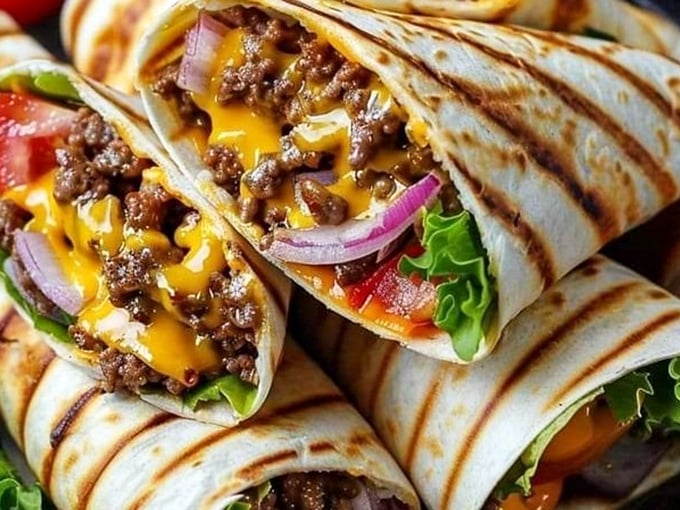 Behold the burrito of your dreams &ndash; where melted cheese meets seasoned beef in a tortilla embrace. This isn't just a meal; it's a hand-held masterpiece.