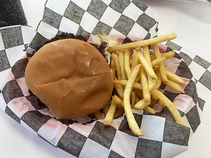 This isn't just a cheeseburger and fries—it's edible nostalgia served on a checkered paper tray.