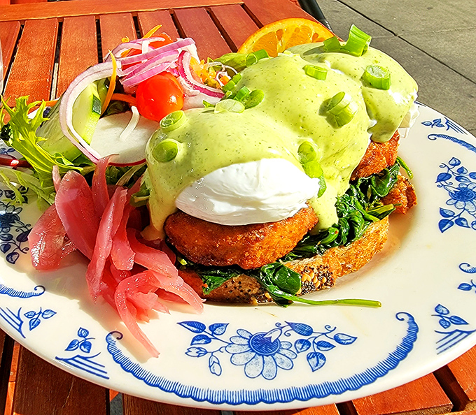This vibrant Benedict crowned with avocado-green hollandaise isn't just breakfast &ndash; it's edible architecture designed to make your taste buds stand at attention.