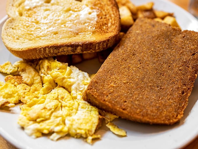 Simple perfection on a plate: fluffy scrambled eggs, crispy scrapple, and golden toast&mdash;the holy trinity of Pennsylvania breakfast done exactly right.