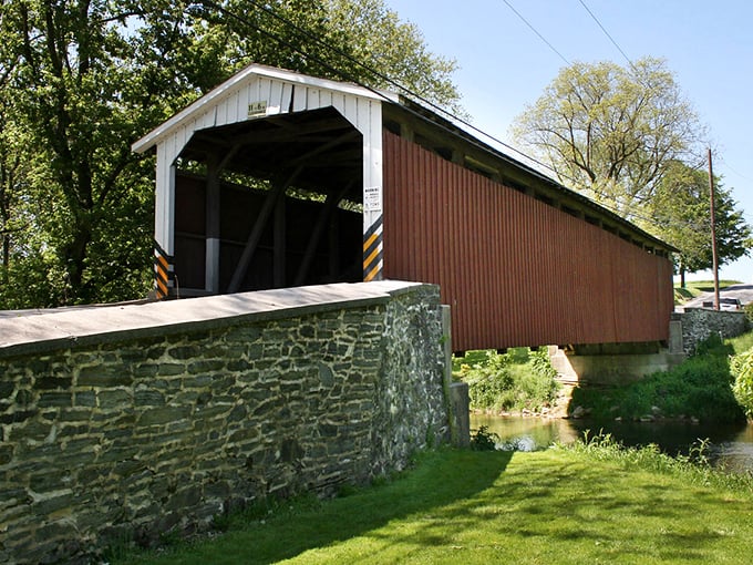 This classic covered bridge isn't just picturesque—it's a time machine to when horse-drawn buggies clip-clopped across wooden planks above gentle waters.