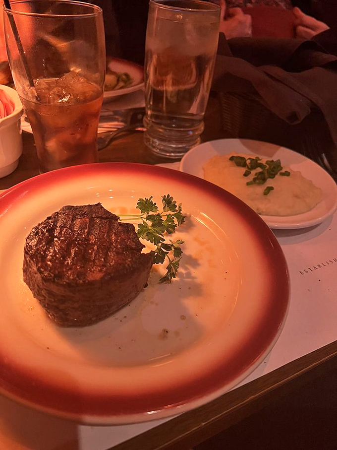 Behold the star of the show&mdash;a perfectly seared filet mignon standing proudly on its plate like a meaty monument to culinary excellence.