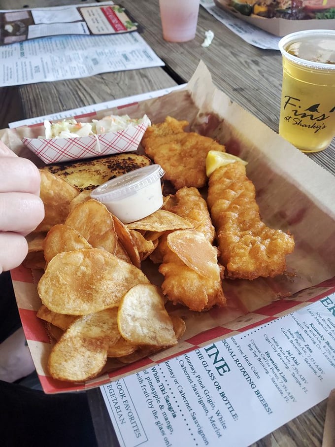 Golden-battered fish that shatters with each bite, paired with house-made chips. This isn't just fish and chips&mdash;it's edible Florida sunshine on a paper tray.