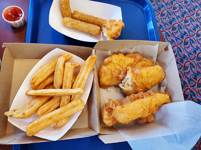 Golden armor of batter protecting flaky white fish alongside thick-cut chips&mdash;this isn't just fast food, it's a British tradition that found its perfect American ambassador.