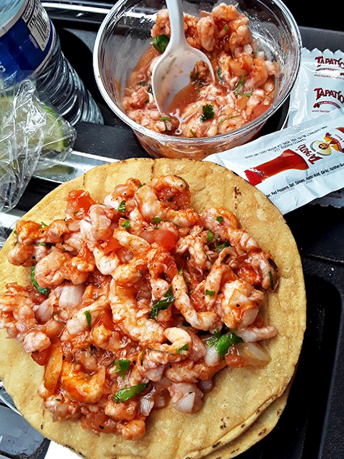 Shrimp tostada paradise! Those rosy crustaceans practically high-five your taste buds while the tostada provides the perfect crunch backdrop.