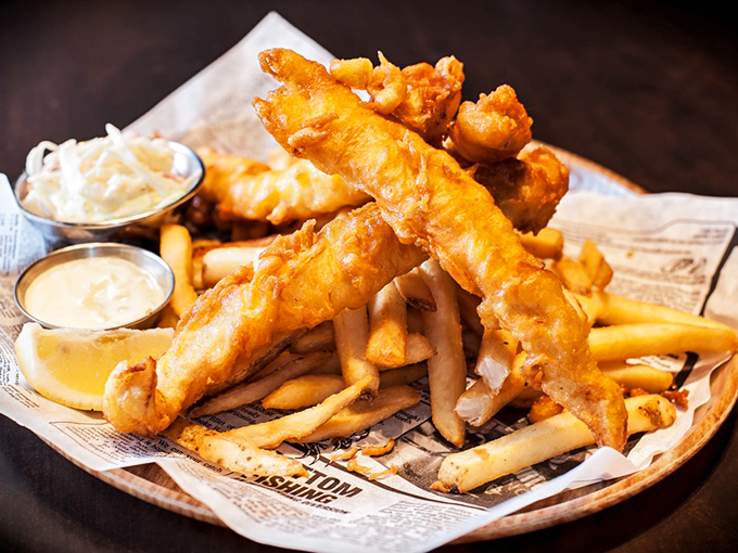 Golden, crispy batter protecting flaky white fish like a delicious fortress. These aren't just fish and chips&mdash;they're the reason people drive across Missouri.