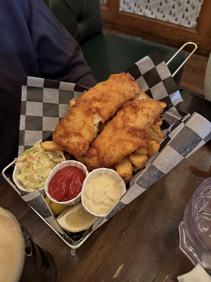 Golden-battered fish that shatters with each bite, nestled alongside chips that somehow manage to be both fluffy and crisp&mdash;culinary wizardry at work.
