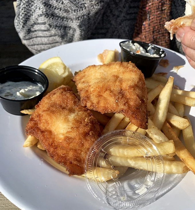 Golden-battered fish that shatters with each bite, alongside fries that could make a Frenchman weep. This isn't just fish and chips&mdash;it's edible poetry.