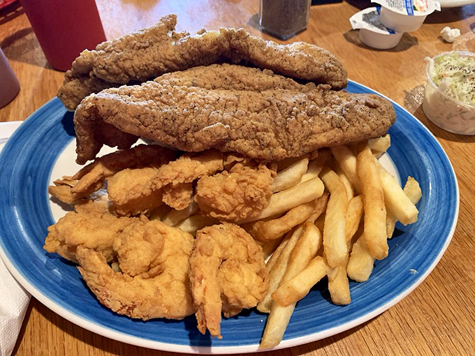 Golden-battered fish fillets lounging atop a bed of crispy fries&mdash;a plate that whispers "vacation" even on a Tuesday in landlocked Walkertown.
