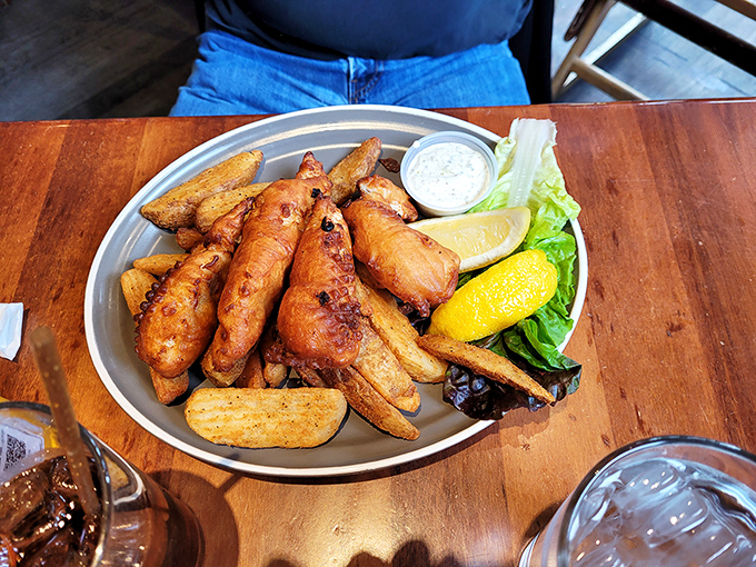 Golden-brown perfection on a metal plate. The fish practically winks at you, saying "Yes, I'm worth every calorie and the trip downtown."