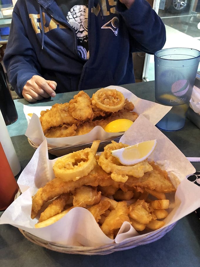 Golden-battered fish nestled alongside crispy calamari rings &ndash; a seafood duet that makes you wonder why you'd ever settle for just one fried delicacy.