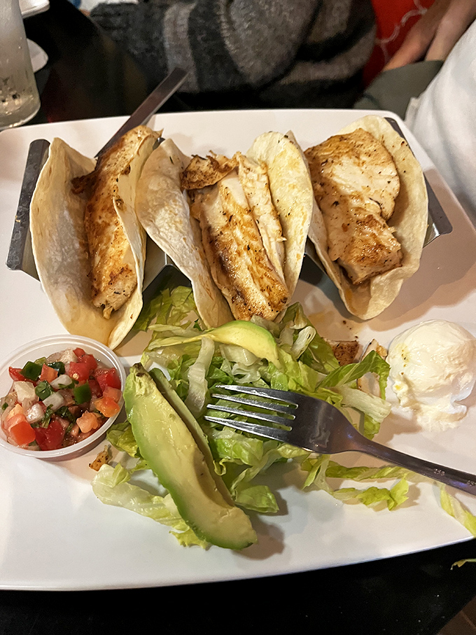 These fish tacos aren't just a meal; they're a vacation on a plate. The fresh avocado and pico de gallo bring a burst of color that matches their flavor.