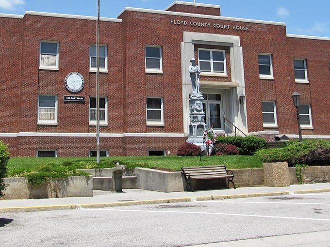 The Floyd County Court House stands as a dignified sentinel of small-town governance, complete with monument and manicured grounds.