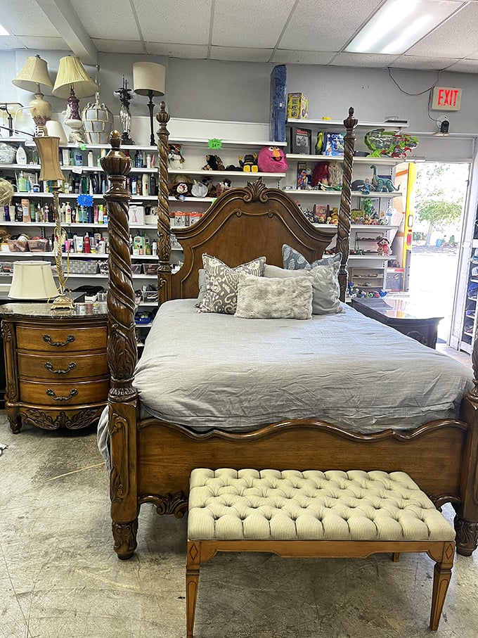 This four-poster bed isn't just sleeping quarters&mdash;it's practically royalty in wood form. The matching bench completes your bedroom's glow-up.