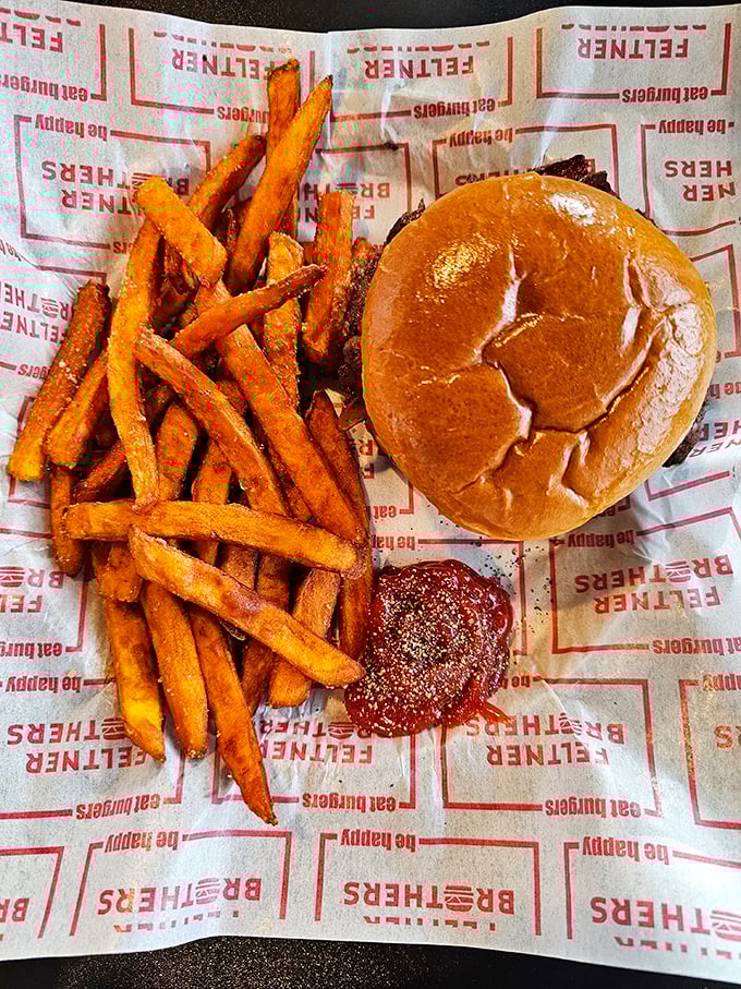 Golden fries with that mythical crisp-outside-fluffy-inside perfection, alongside a burger that makes fast food chains weep with inadequacy.