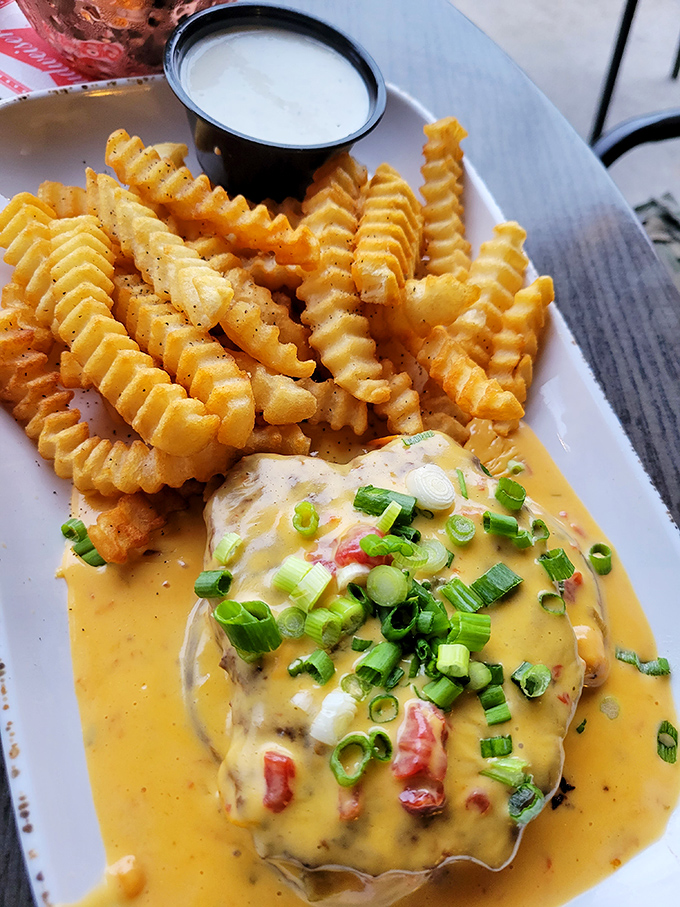 These aren't just crinkle-cut fries&mdash;they're ridged potato masterpieces designed to maximize sauce-to-spud ratio. That cheese sauce could make cardboard taste good.