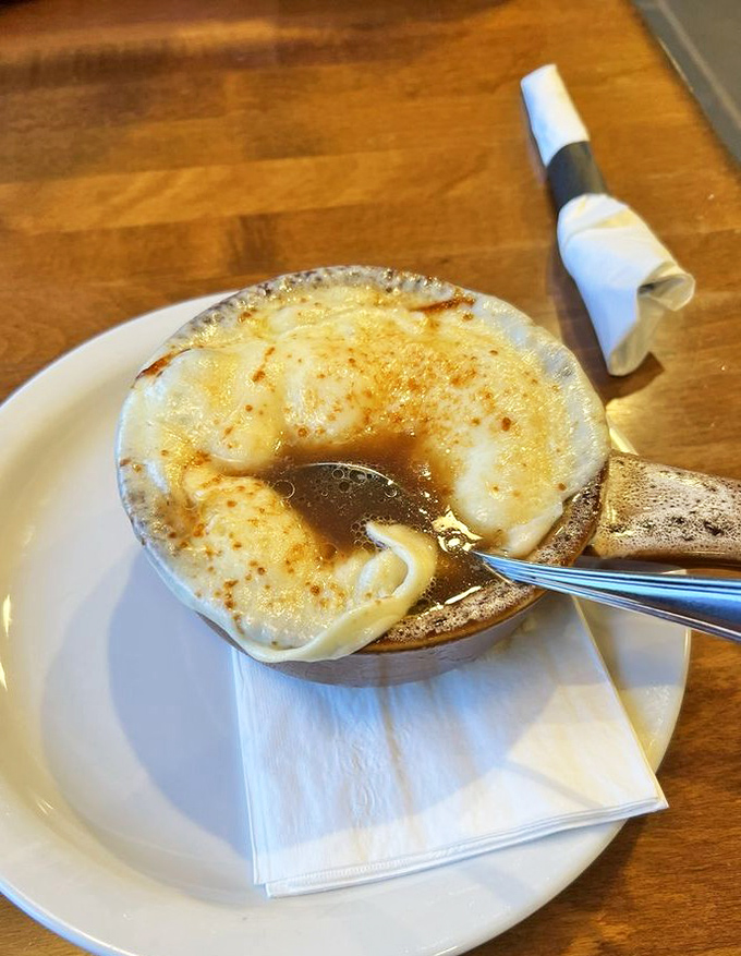 French onion soup nirvana! That golden, bubbling cheese canopy is the edible equivalent of a warm hug after a long Pennsylvania winter.