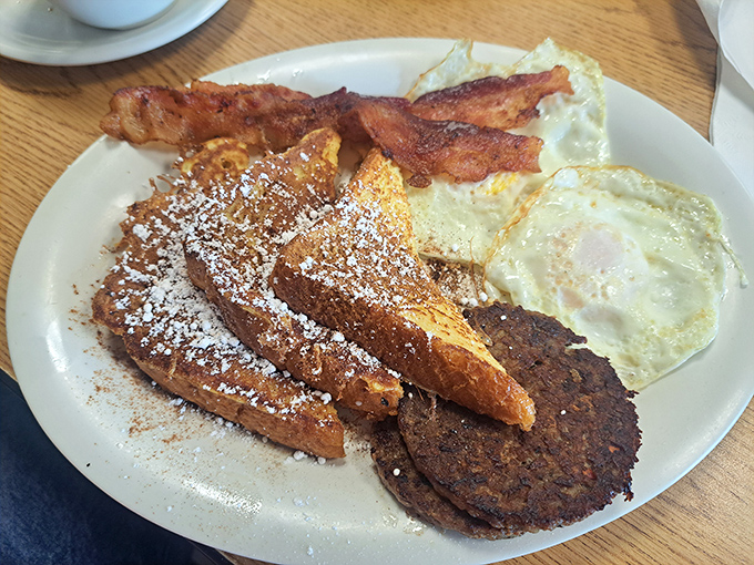 French toast that's powdered sugar perfection, eggs with just-right edges, and bacon that snaps with each bite &ndash; the breakfast holy trinity.