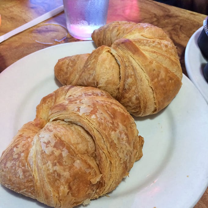Golden, flaky croissants that shatter into buttery shards with each bite&mdash;proof that simple pleasures are often the most profound.